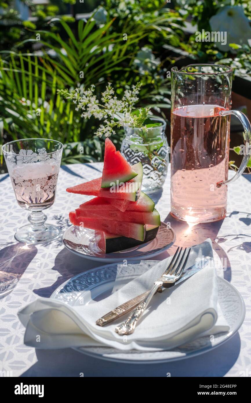 Bubbly cava cocktail garnished with slides of watermelon Stock Photo ...