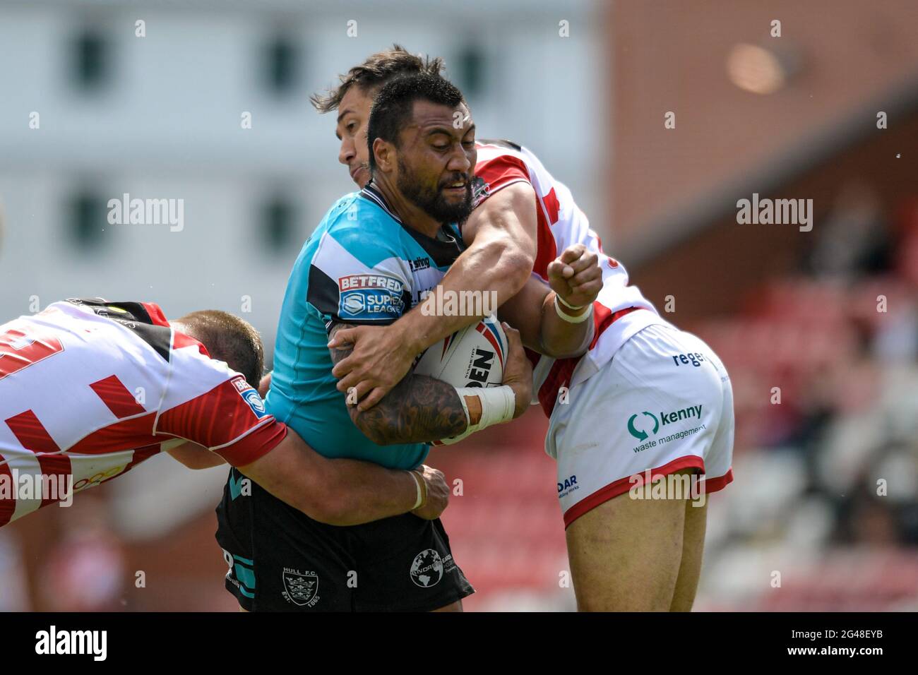 Ligi Sao (13) of Hull FC is tackled by Nathan Mason (19) of Leigh ...