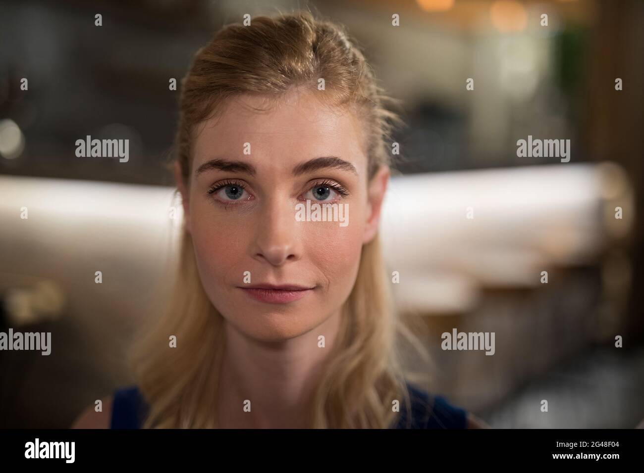 Confident woman sitting in restaurant Stock Photo - Alamy