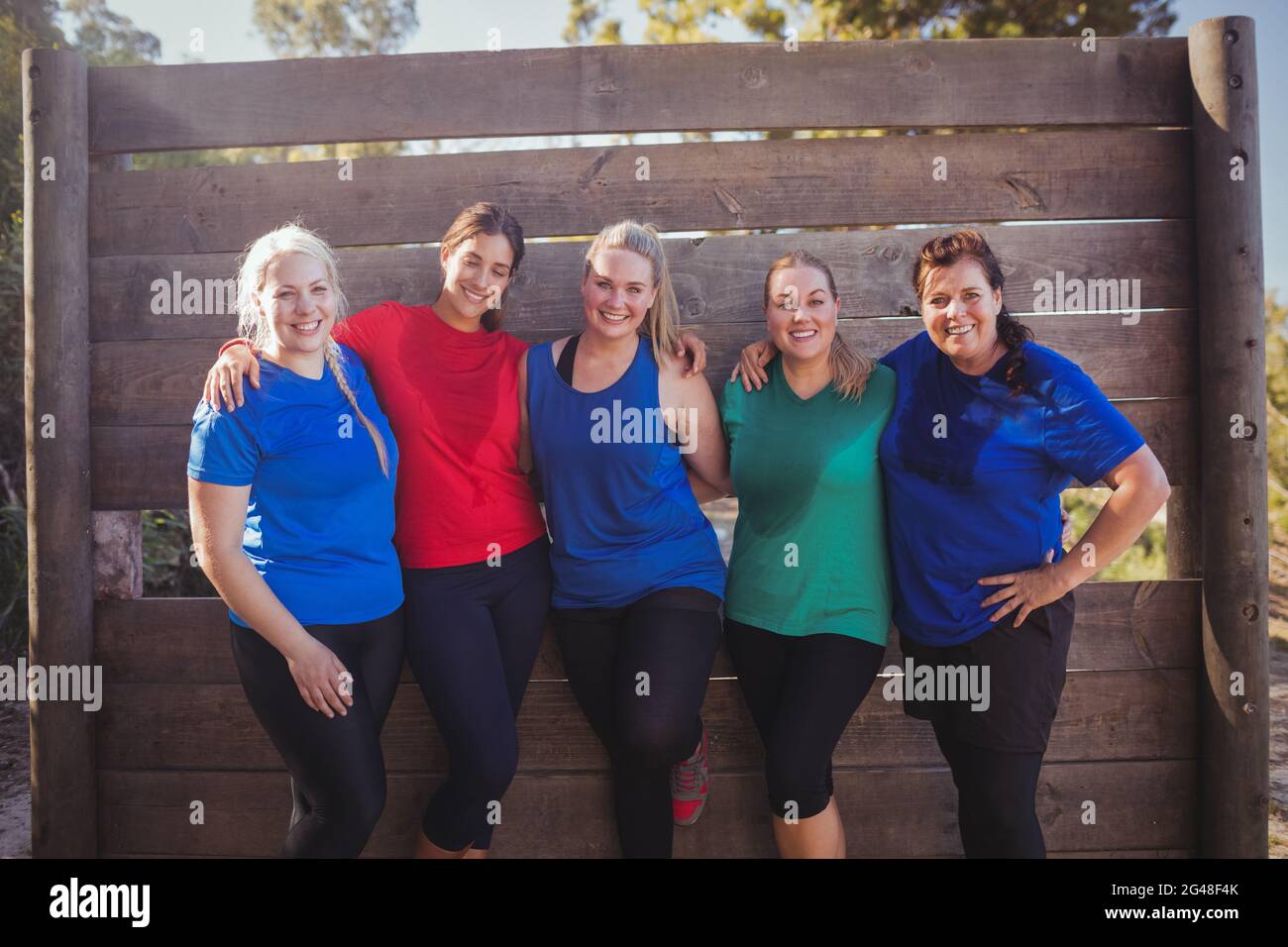 Group of fit women standing together in the boot camp Stock Photo - Alamy