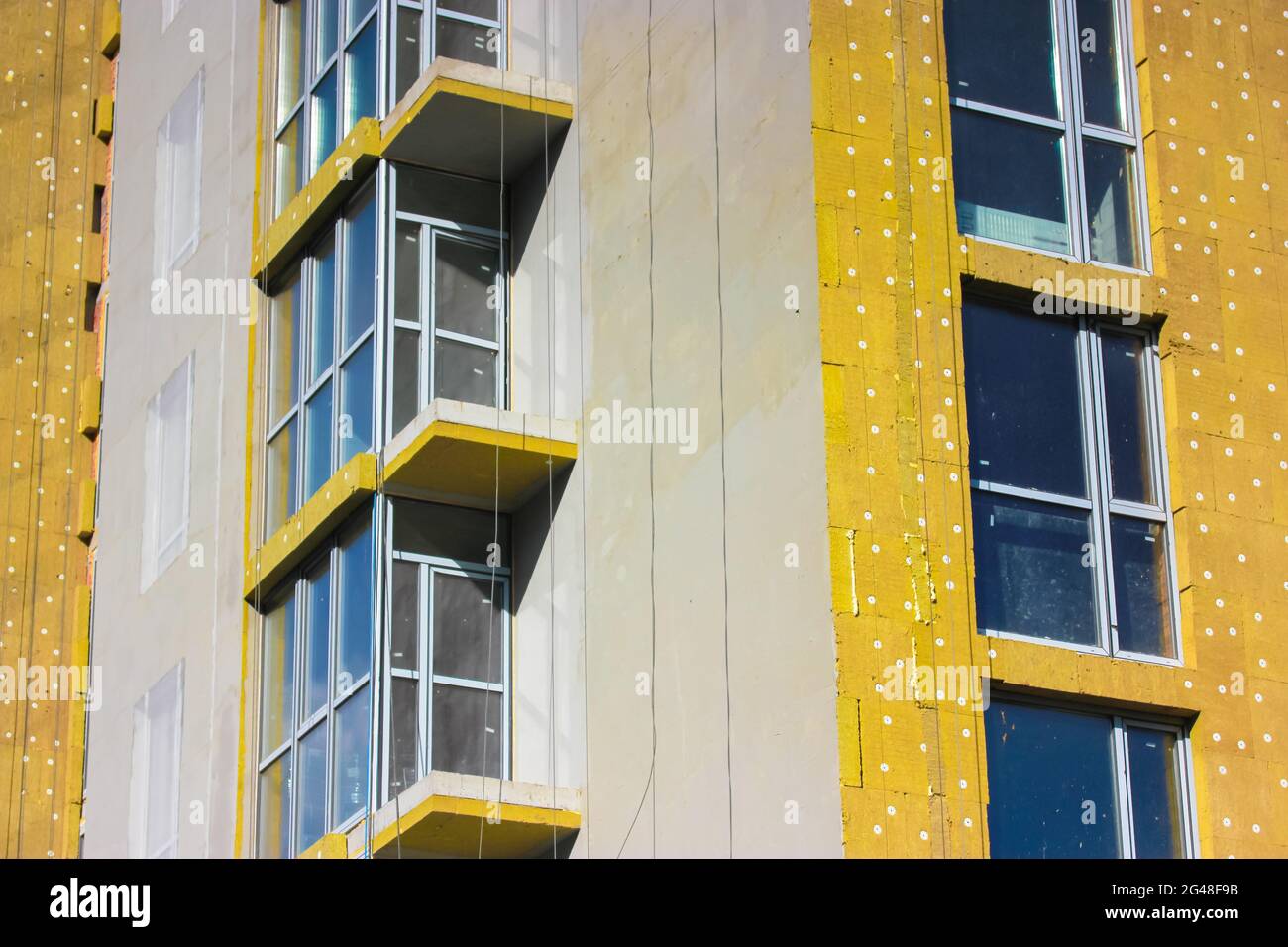 Warming of a multi-story residential building facade with a mineral ...