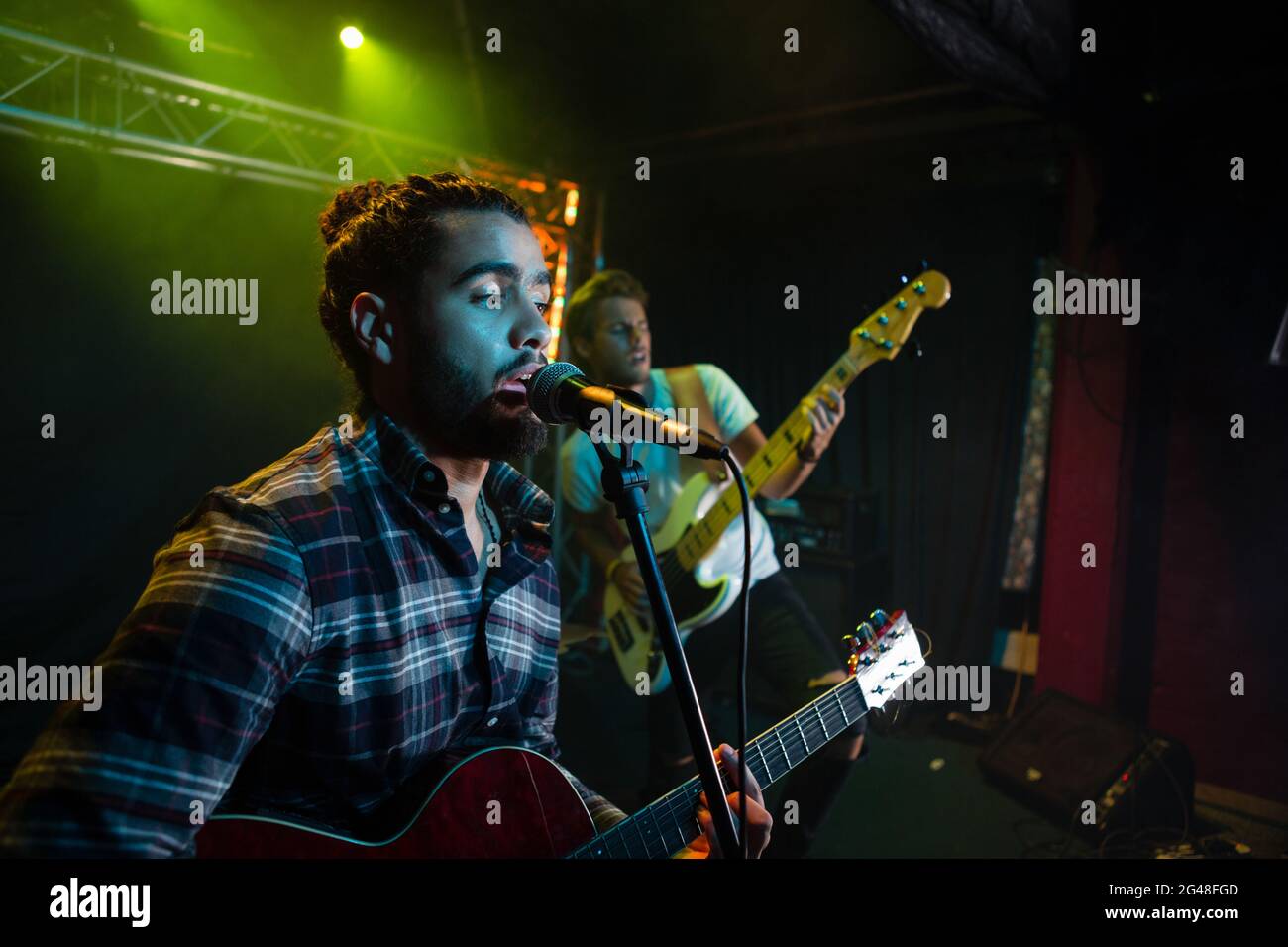 Band performing on stage Stock Photo - Alamy