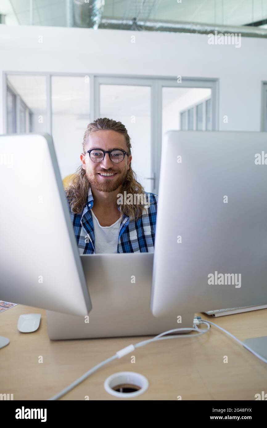 Male executive working over computer hi-res stock photography and ...