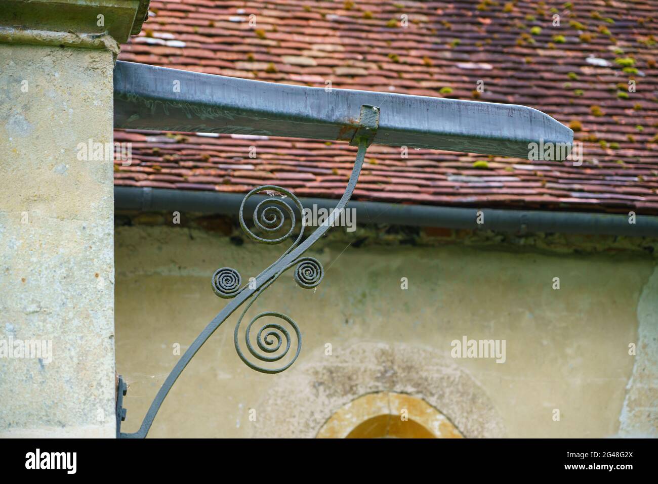 extending lead drain pipe work on the end of a saxon church gable Stock ...