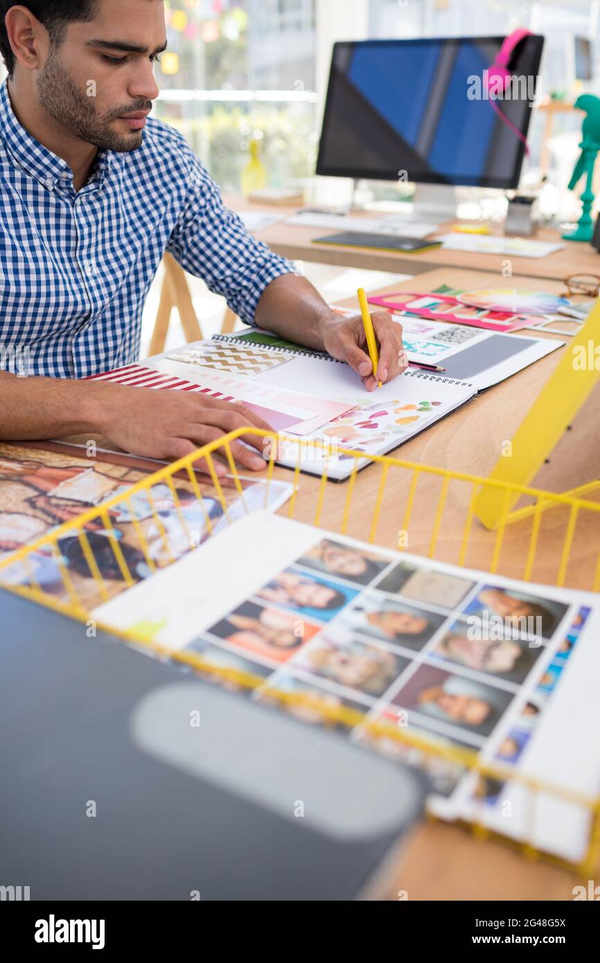 Desk with computer and swatch book hi-res stock photography and images ...