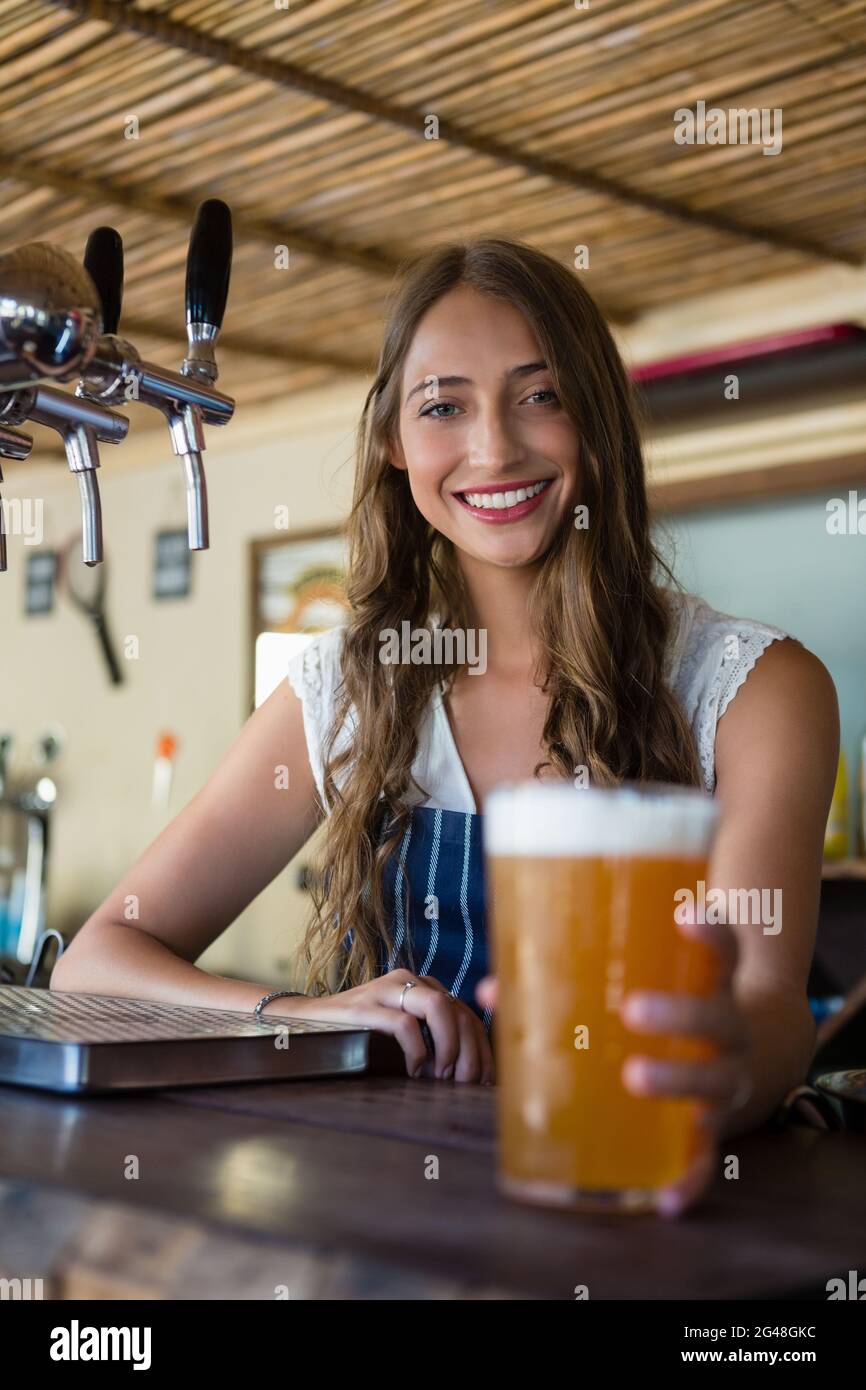 Barmaid holding beer hi-res stock photography and images - Alamy