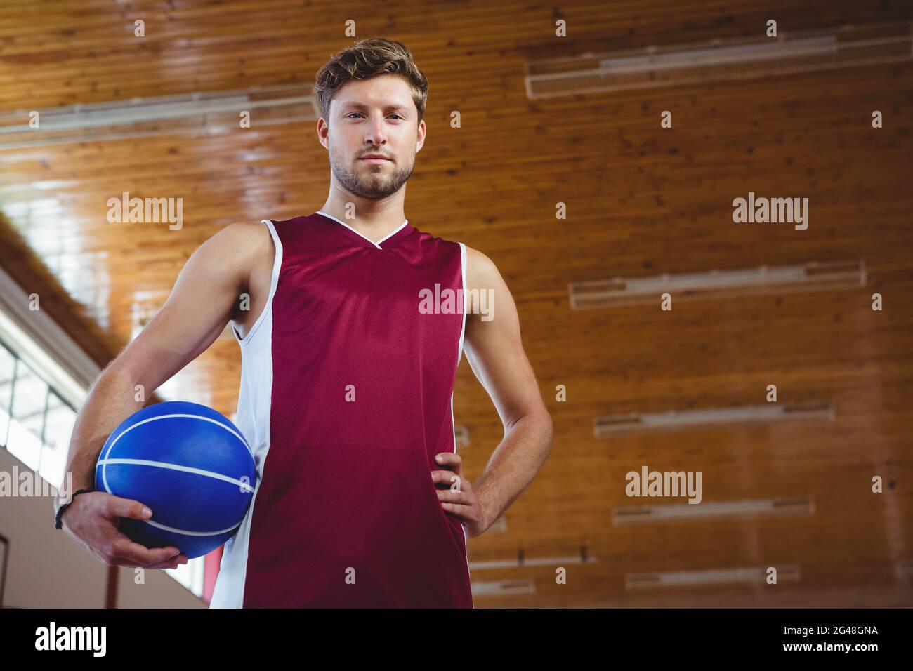 Hip young man holding basketball hi-res stock photography and images ...