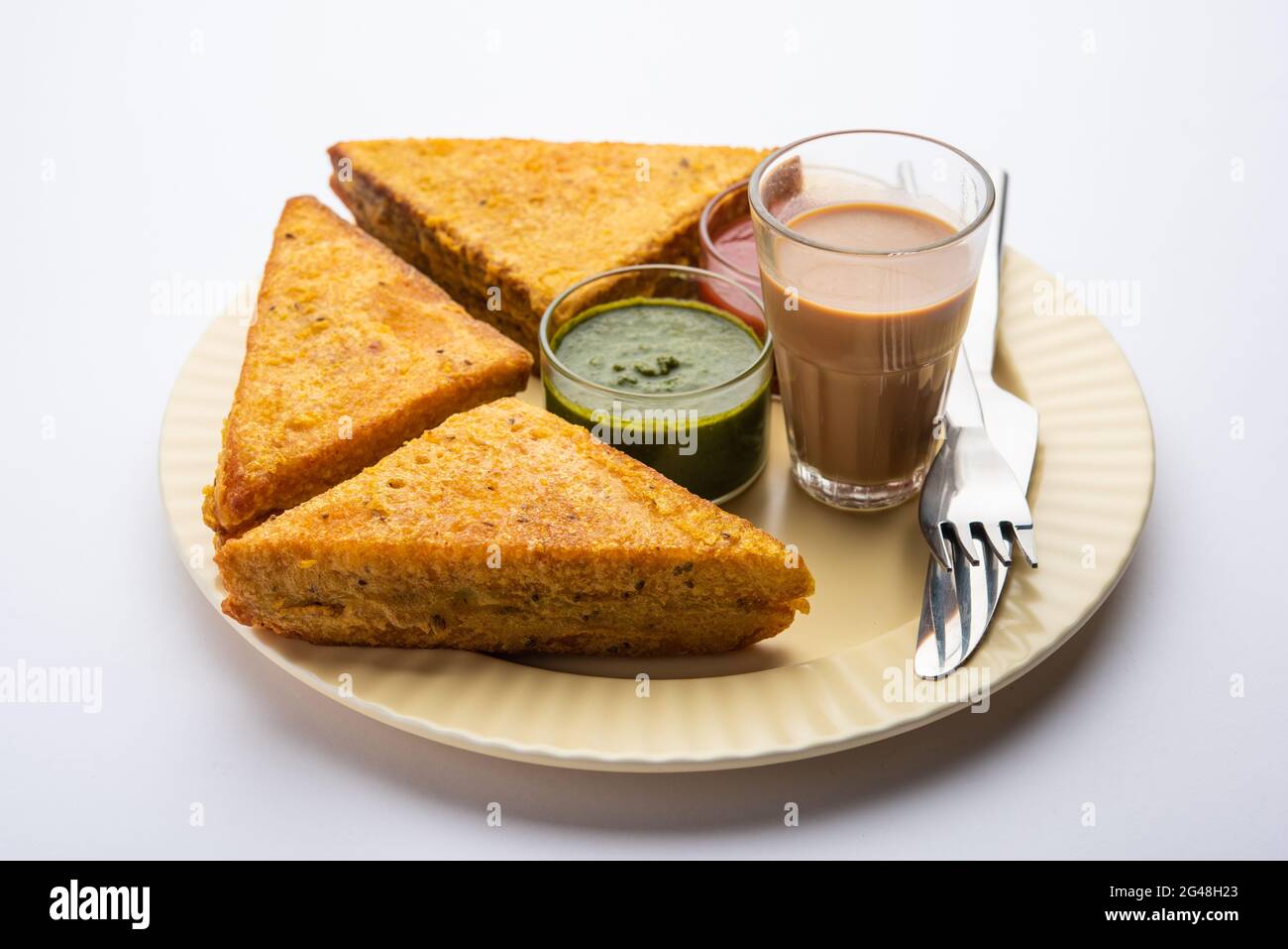 Sandwich Bread Pakora or triangle shape pakoda served with tomato ...