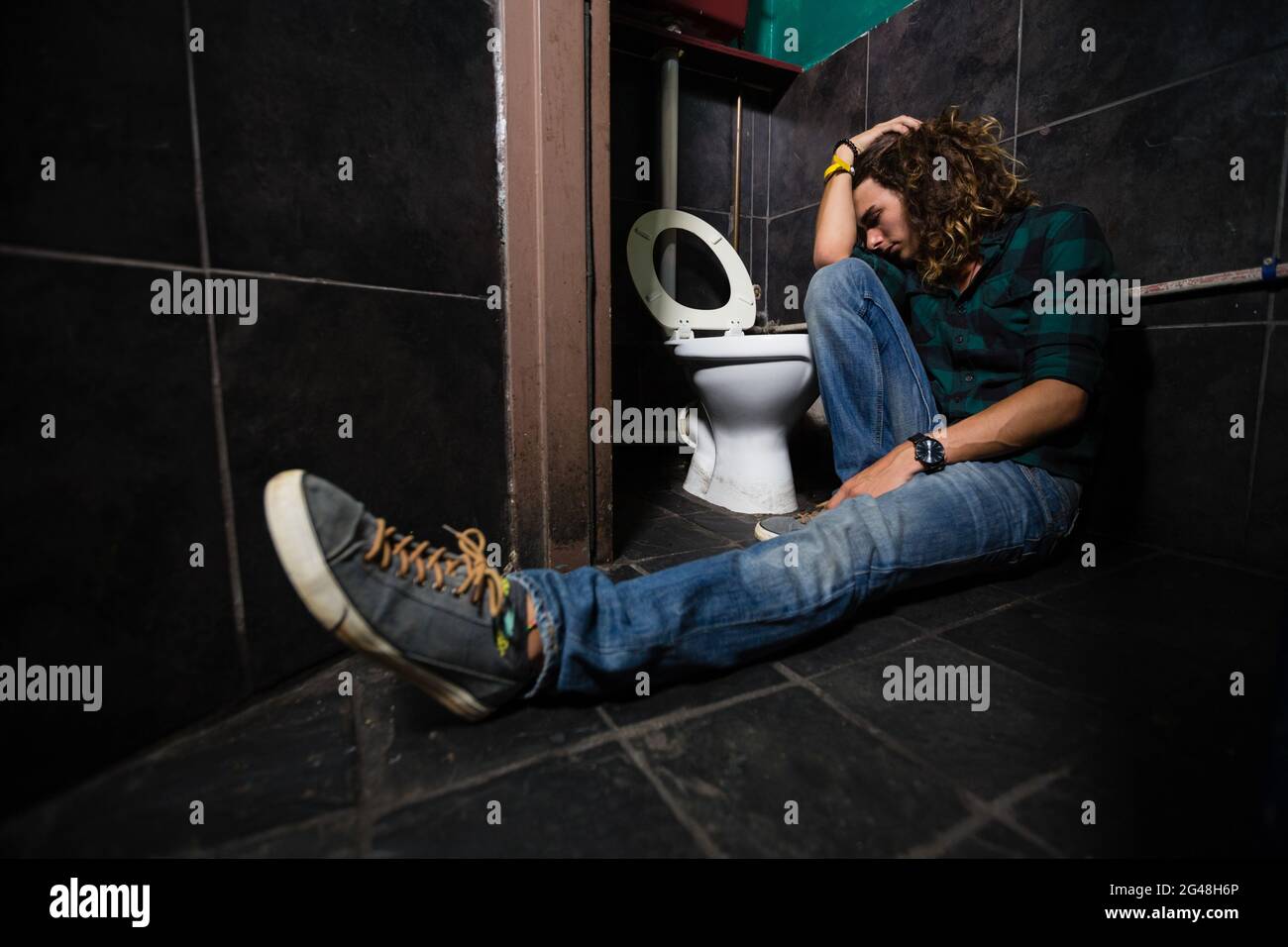 Man sleeping in the washroom Stock Photo - Alamy