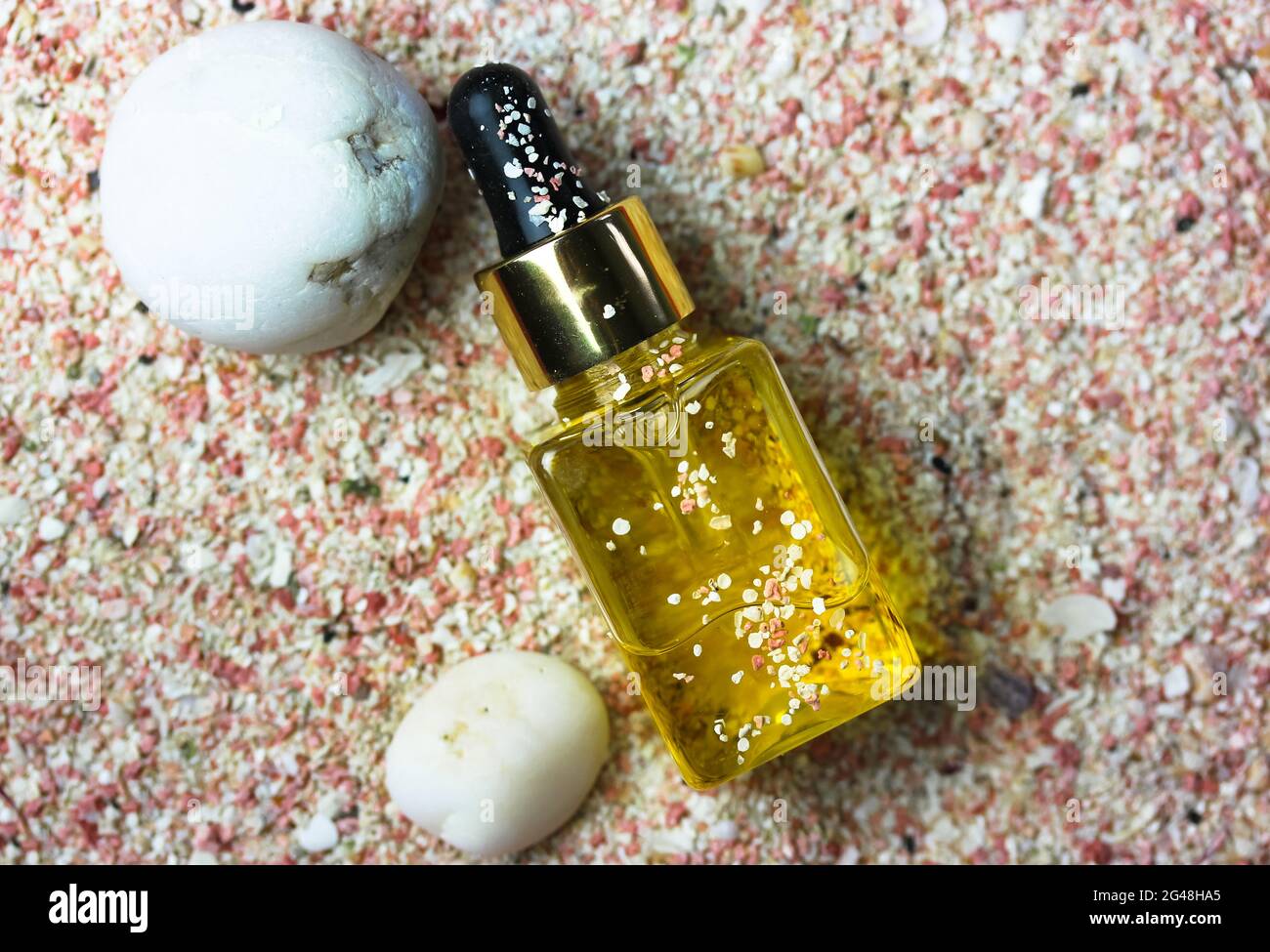 Yellow oil serum essence in glass bottle flatly. Sunscreen oil to ...