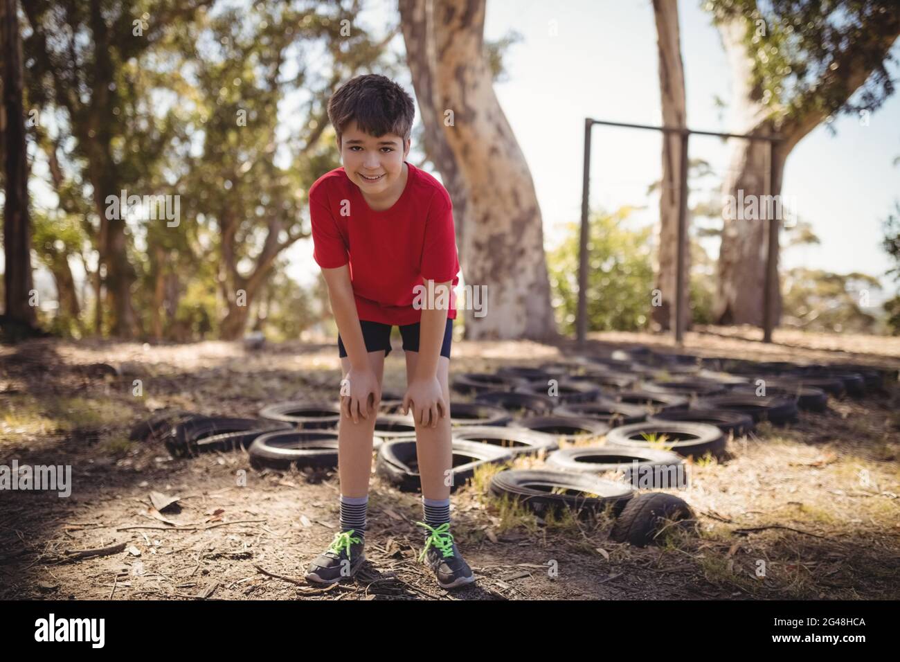 Portrait of tired boy standing in boot camp Stock Photo - Alamy