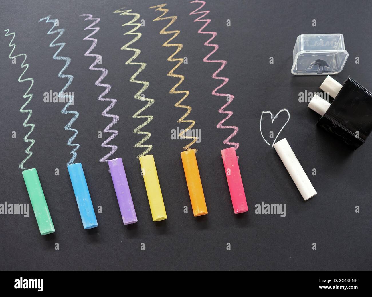 Black chalk board with crayons for writing and drawing Stock Photo - Alamy