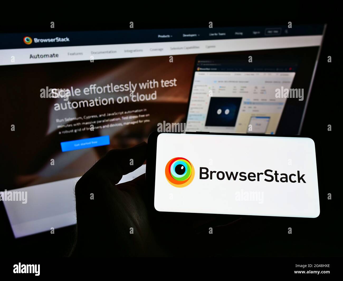 Person holding cellphone with logo of Indian mobile testing company ...
