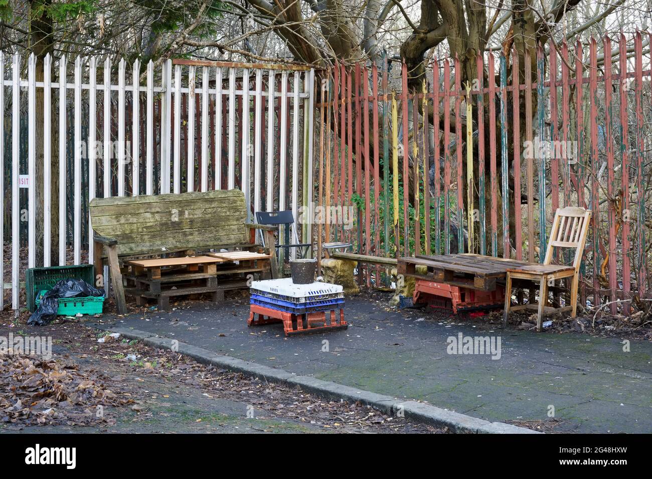 Empty seats and table in smoking area outside work factory Stock Photo ...
