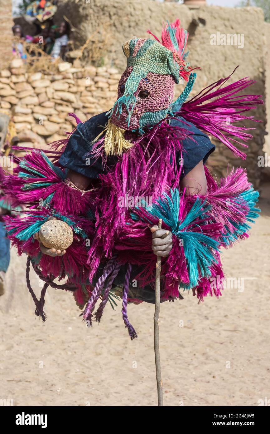 Dogon dancers performing the Dama ritual dance wearing Kanaga masks ...