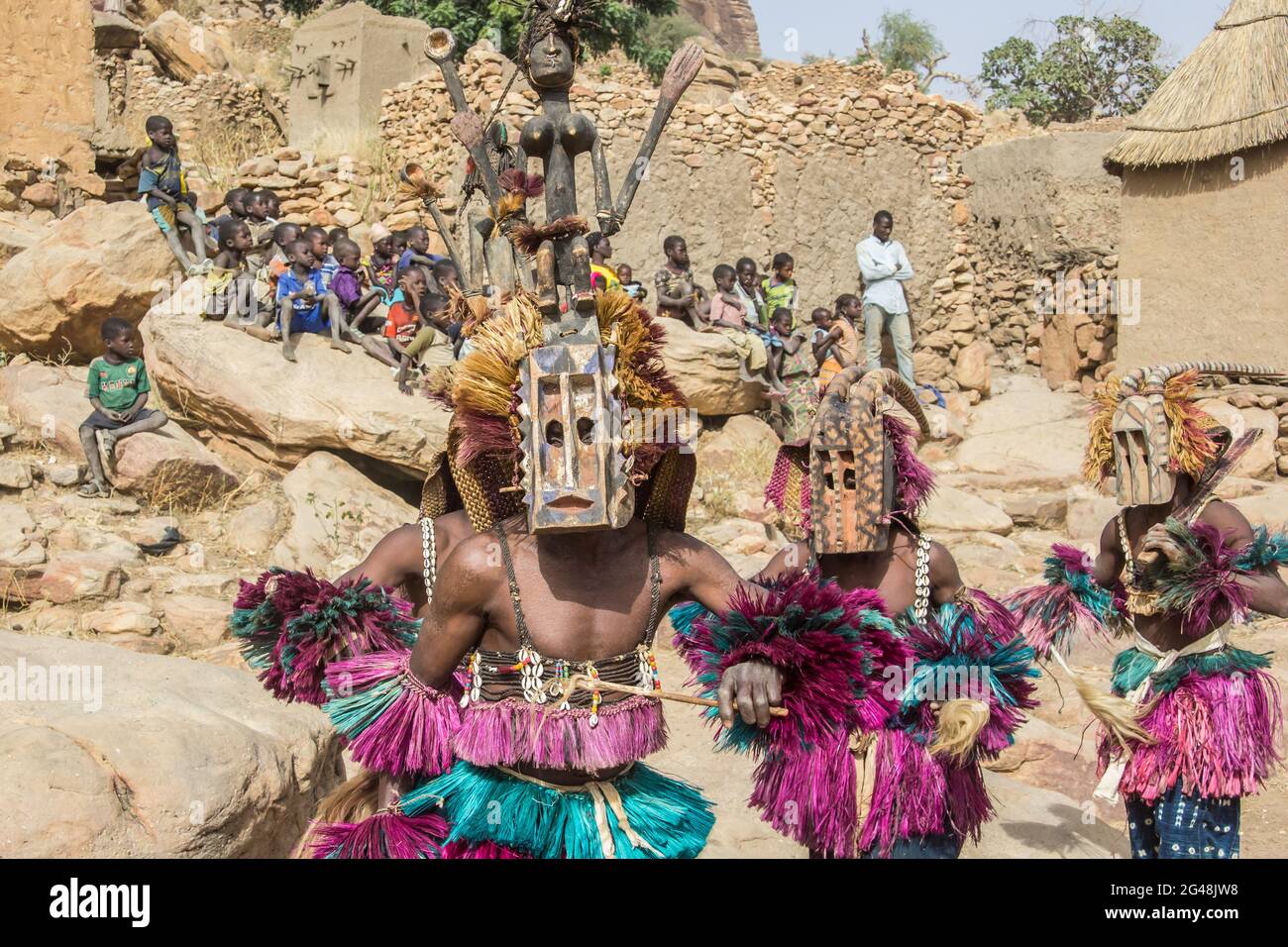Dogon dancers performing the Dama ritual dance wearing Kanaga masks ...