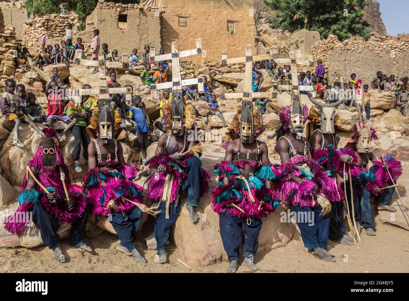 Dogon dancers performing the Dama ritual dance wearing Kanaga masks ...
