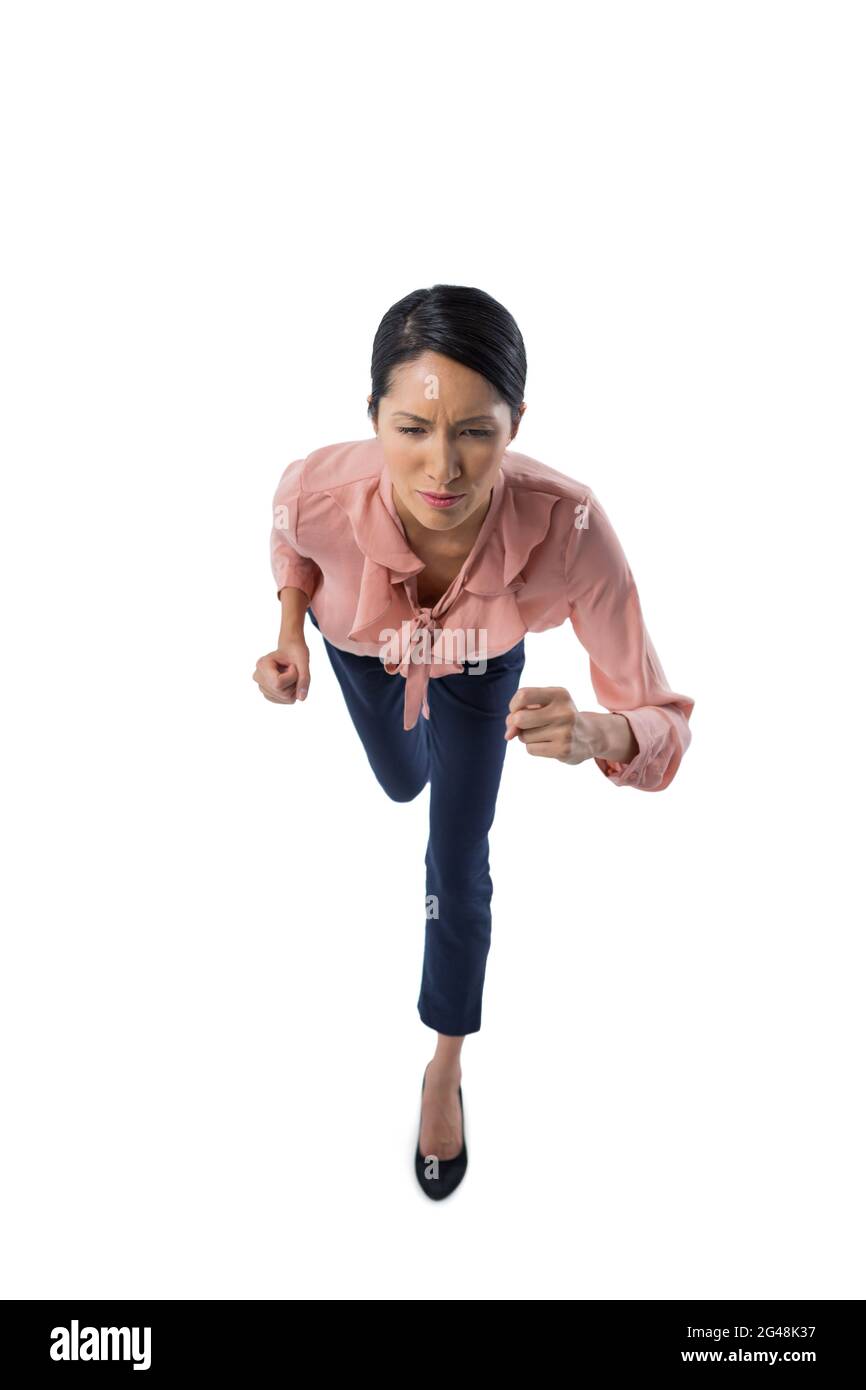 Female executive in ready position Stock Photo - Alamy