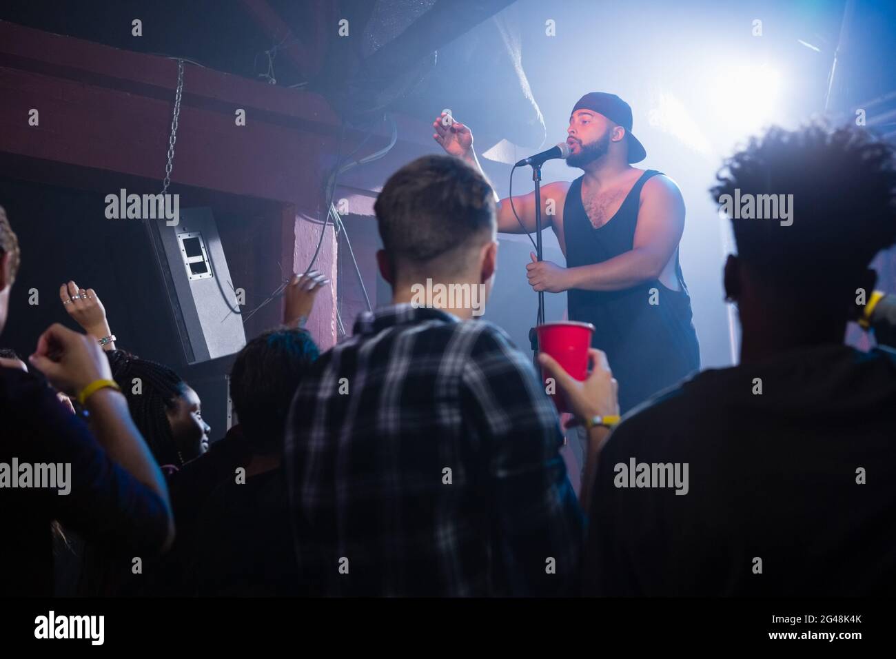 Singer performing on stage Stock Photo - Alamy
