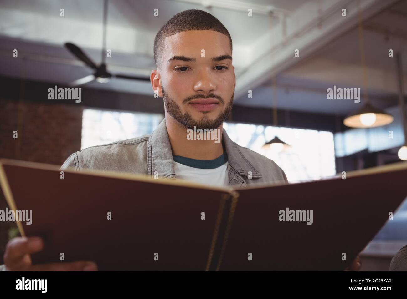 Man reading menu Stock Photo - Alamy