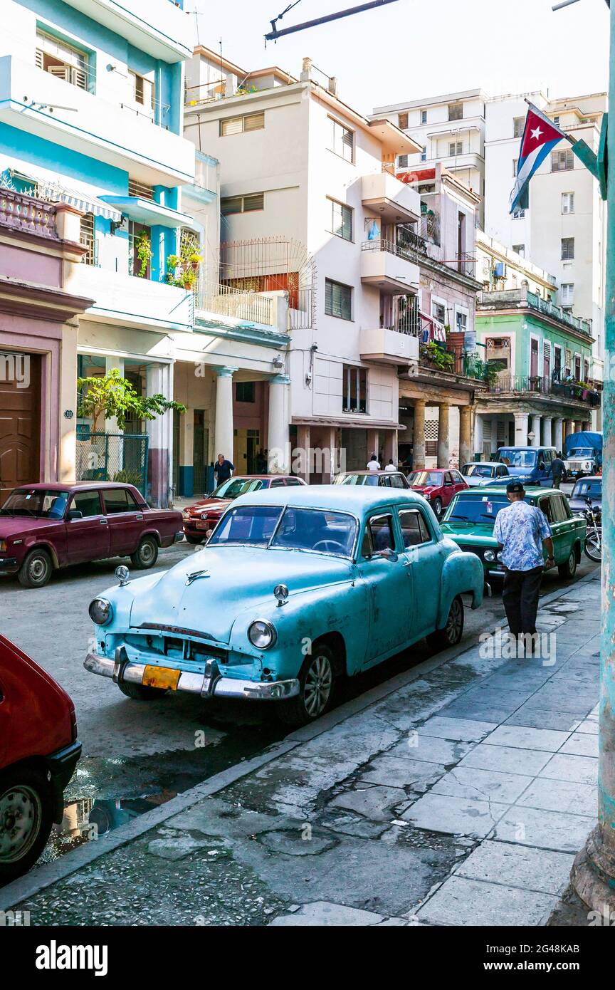 Residential Havana street with parked vintage and late model cars ...