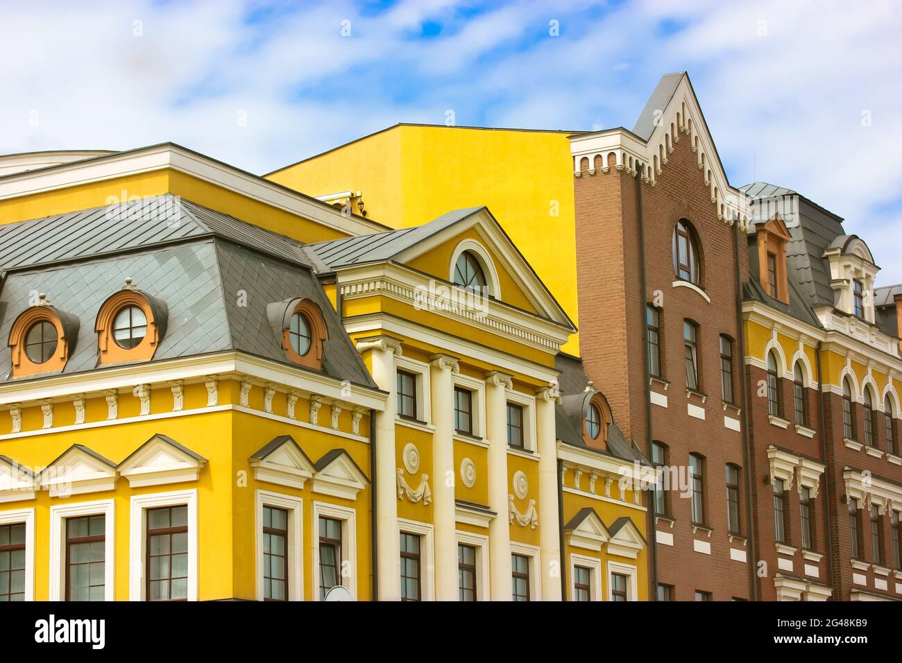 Classical architecture exterior. Beautiful bright yellow and brown ...