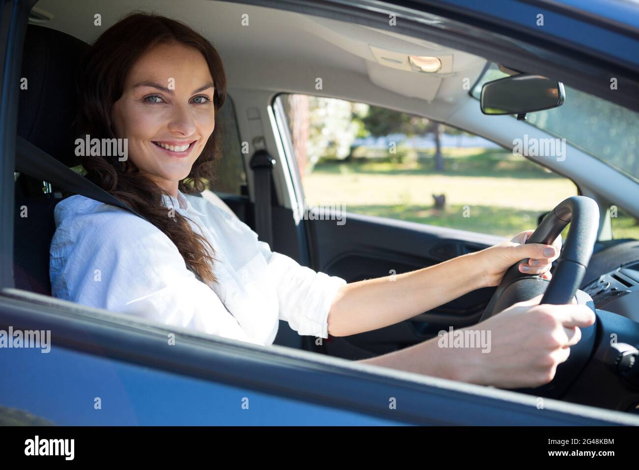 Beautiful woman driving a car Stock Photo - Alamy