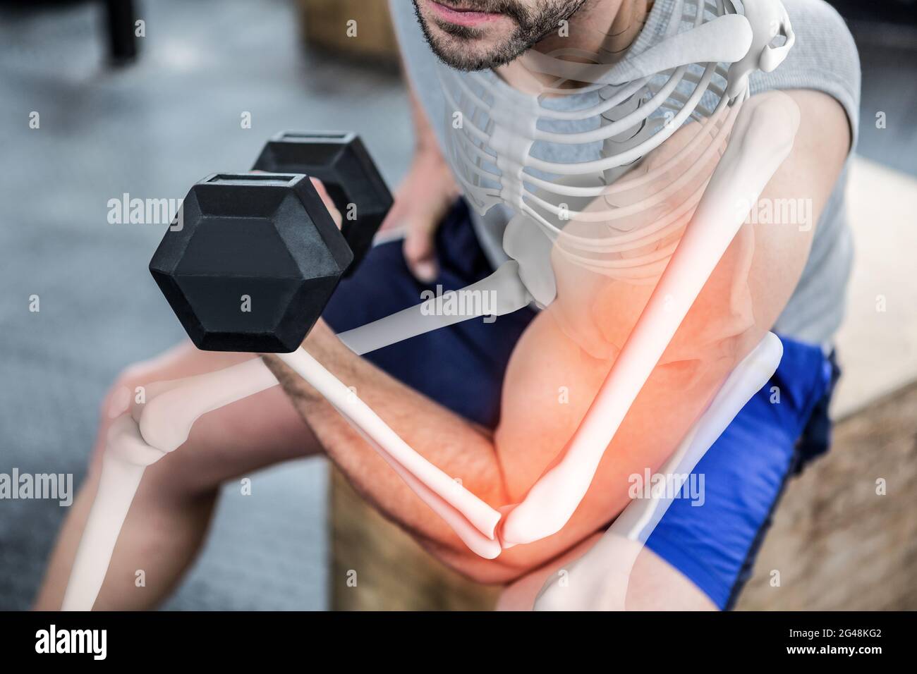 Highlighted arm of strong man lifting weights at gym Stock Photo - Alamy