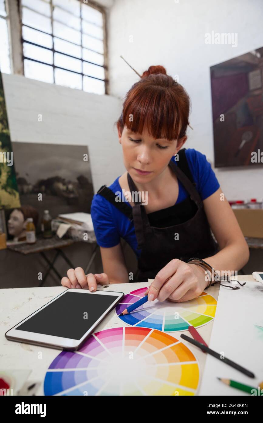 Beautiful woman matching color with color swatch Stock Photo - Alamy