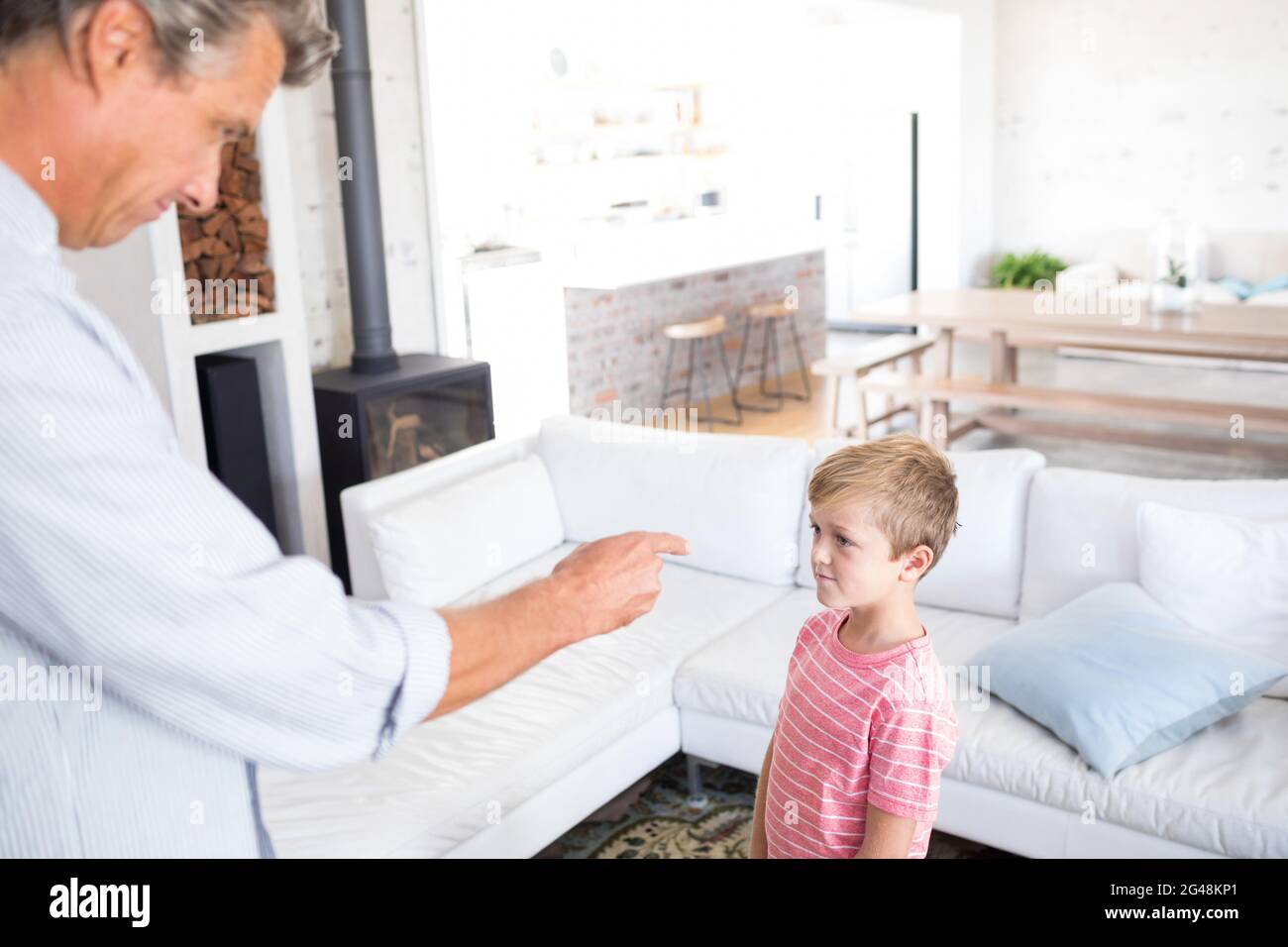 Angry father scolding his son in living room Stock Photo - Alamy