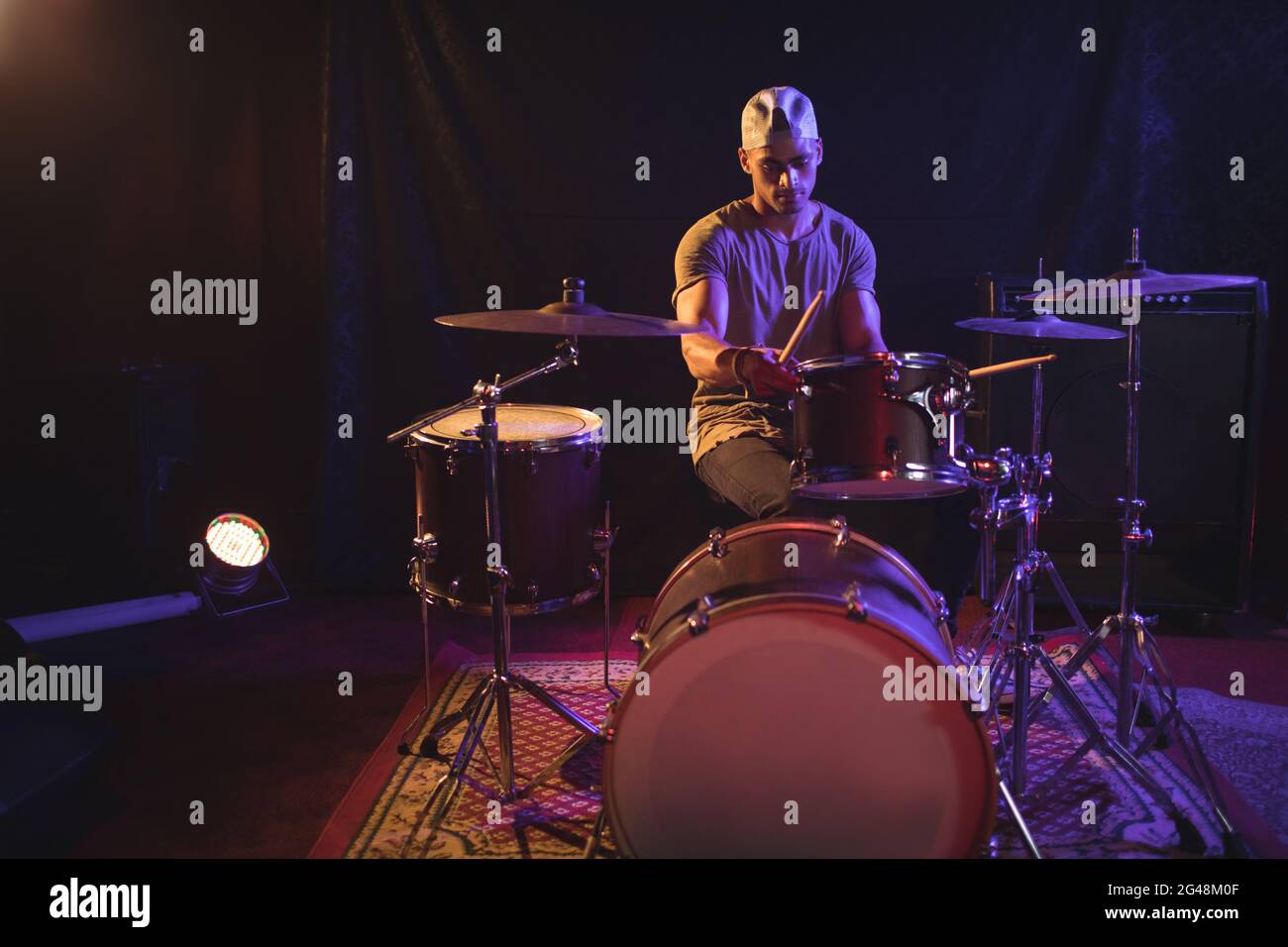 Male drummer performing in nightclub Stock Photo - Alamy