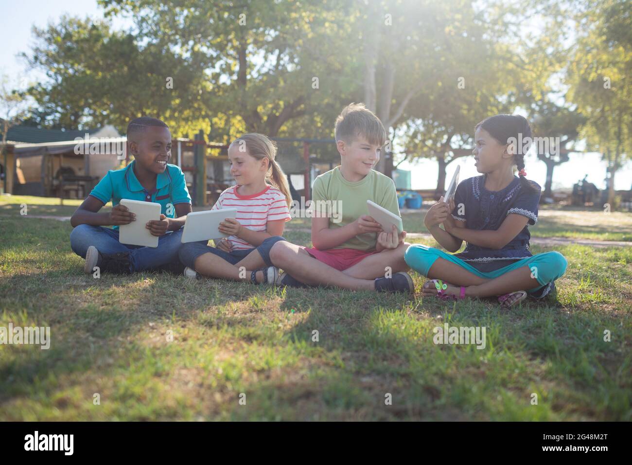 Caucasian friendly children sitting on hi-res stock photography and ...