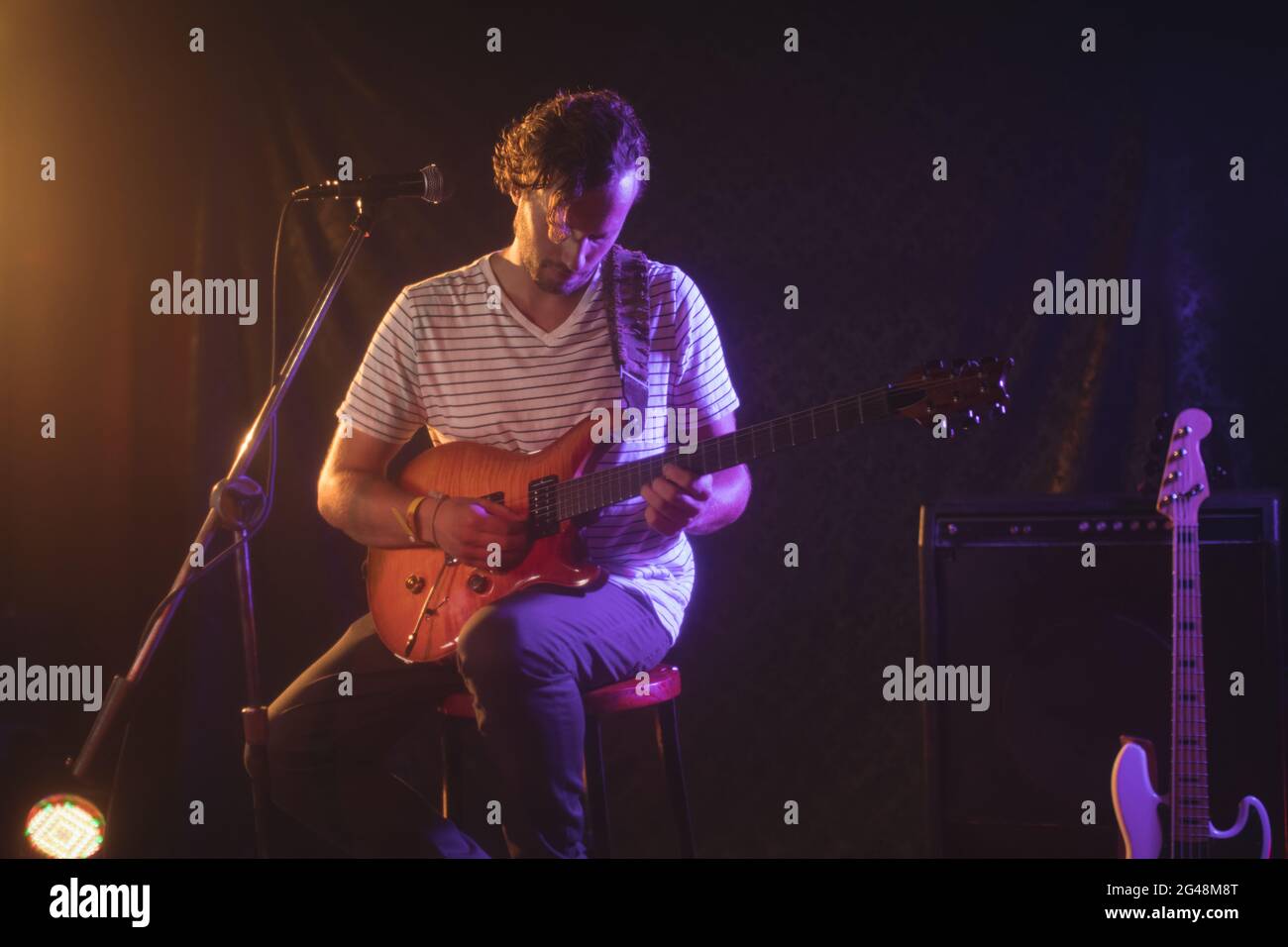 Male singer performing in music concert Stock Photo - Alamy
