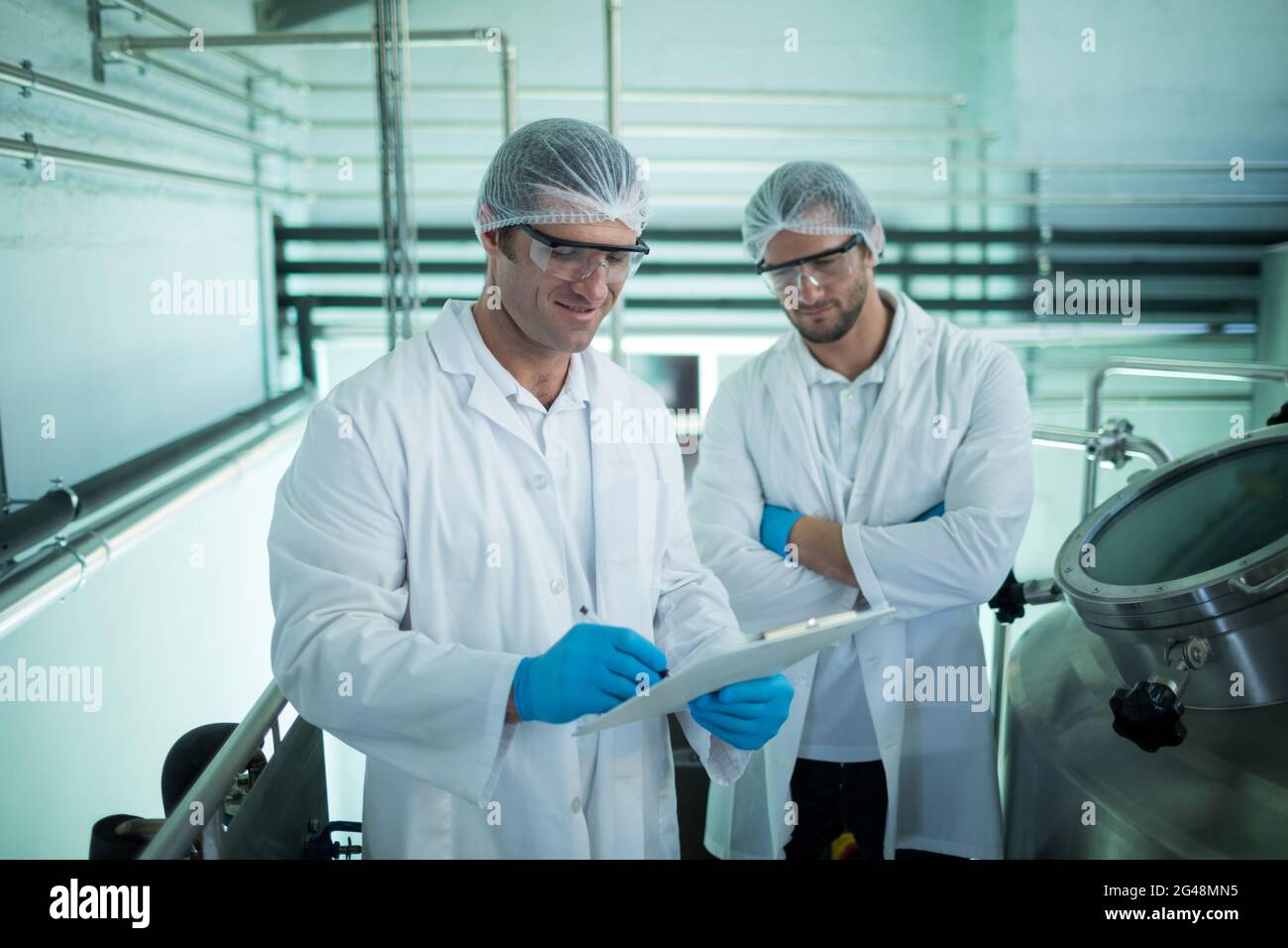 Two young scientists holding hi-res stock photography and images - Alamy