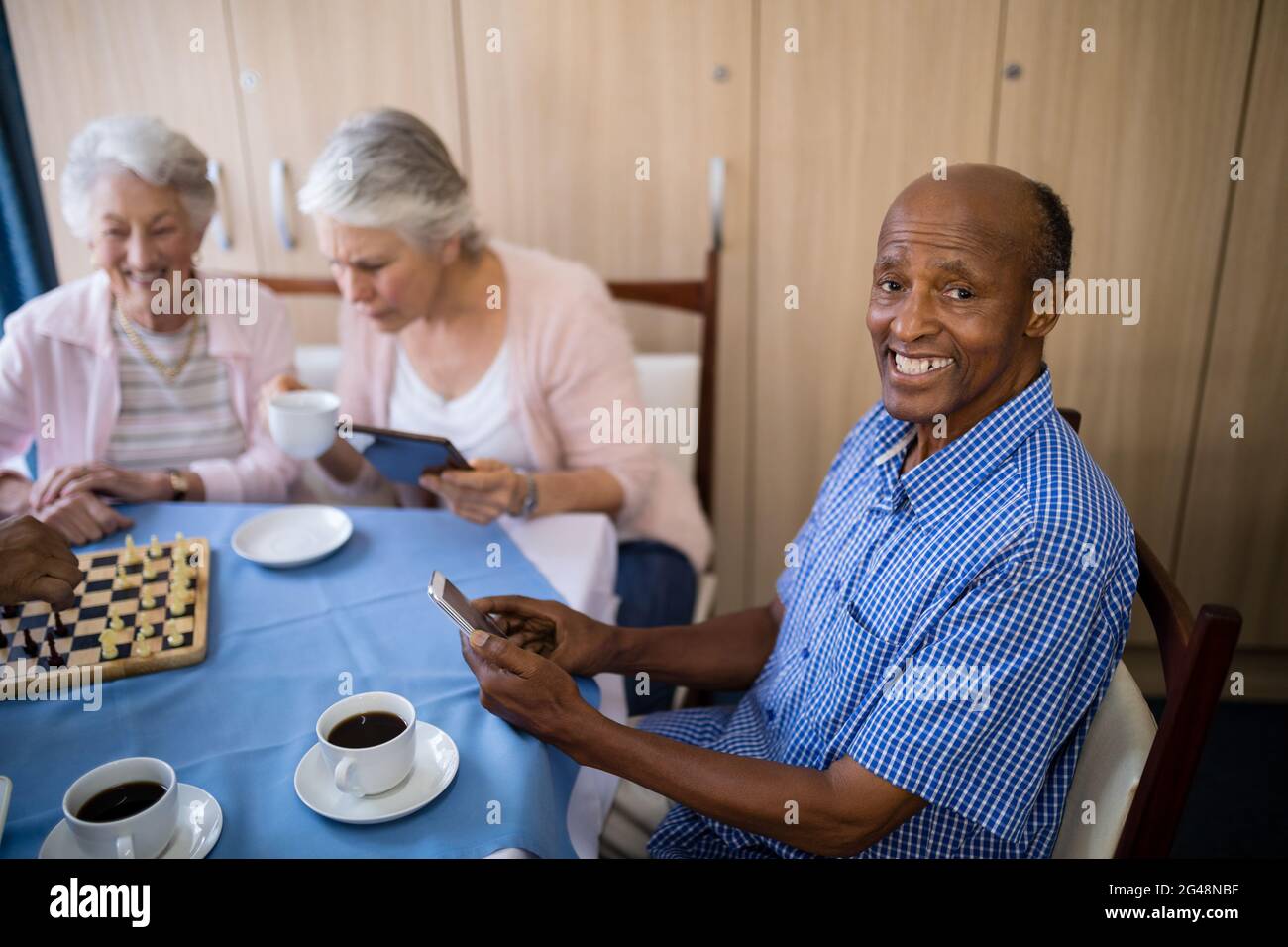 Elderly friends having tea hi-res stock photography and images - Alamy