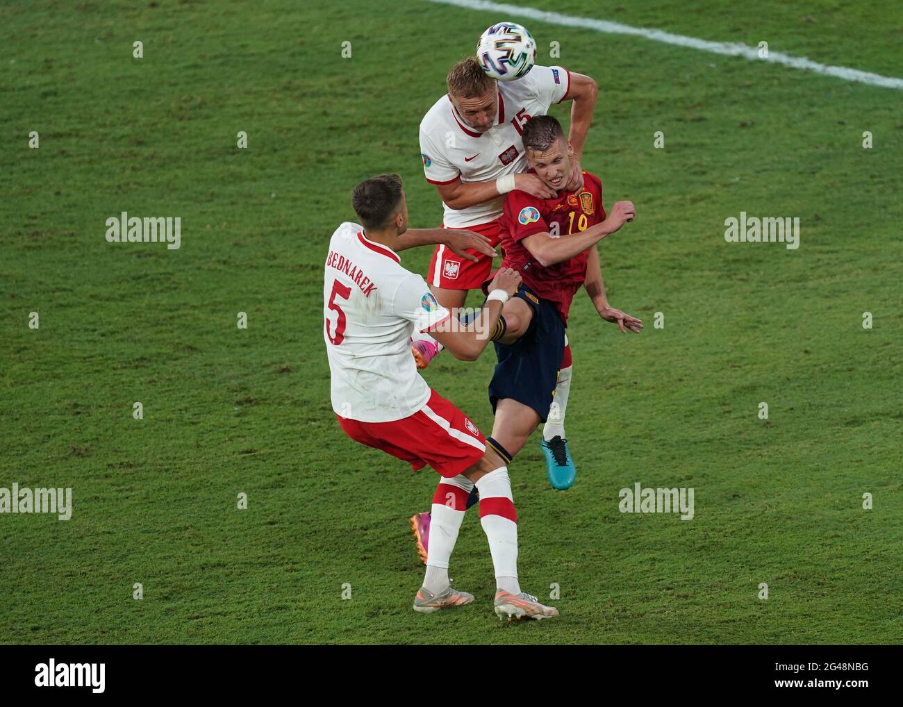 Dani Olmo of Spain and Kamil Glik and Jan Bednarek of Poland during the match between Spain and ...