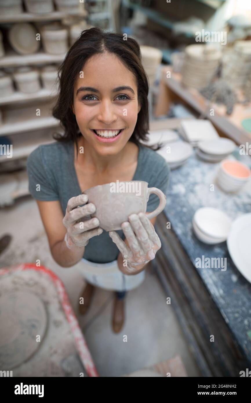 Portrait female potter holding hi-res stock photography and images - Alamy
