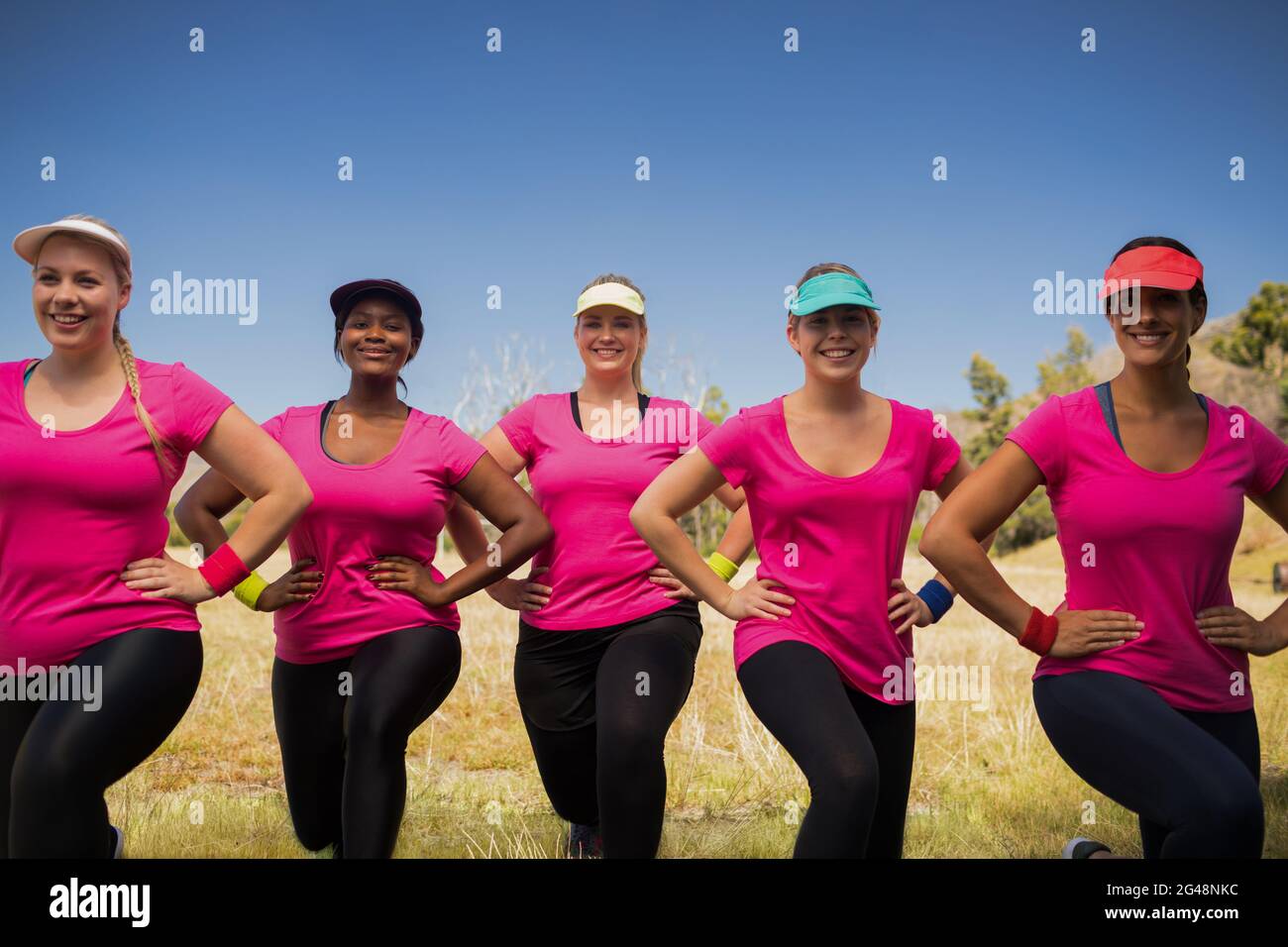 Group of women exercising together in the boot camp Stock Photo - Alamy