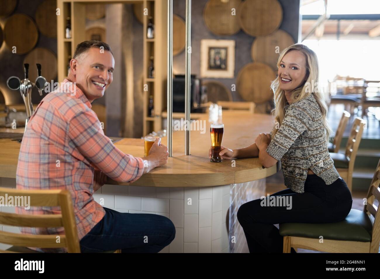 Two friends having beer bar hi-res stock photography and images - Alamy