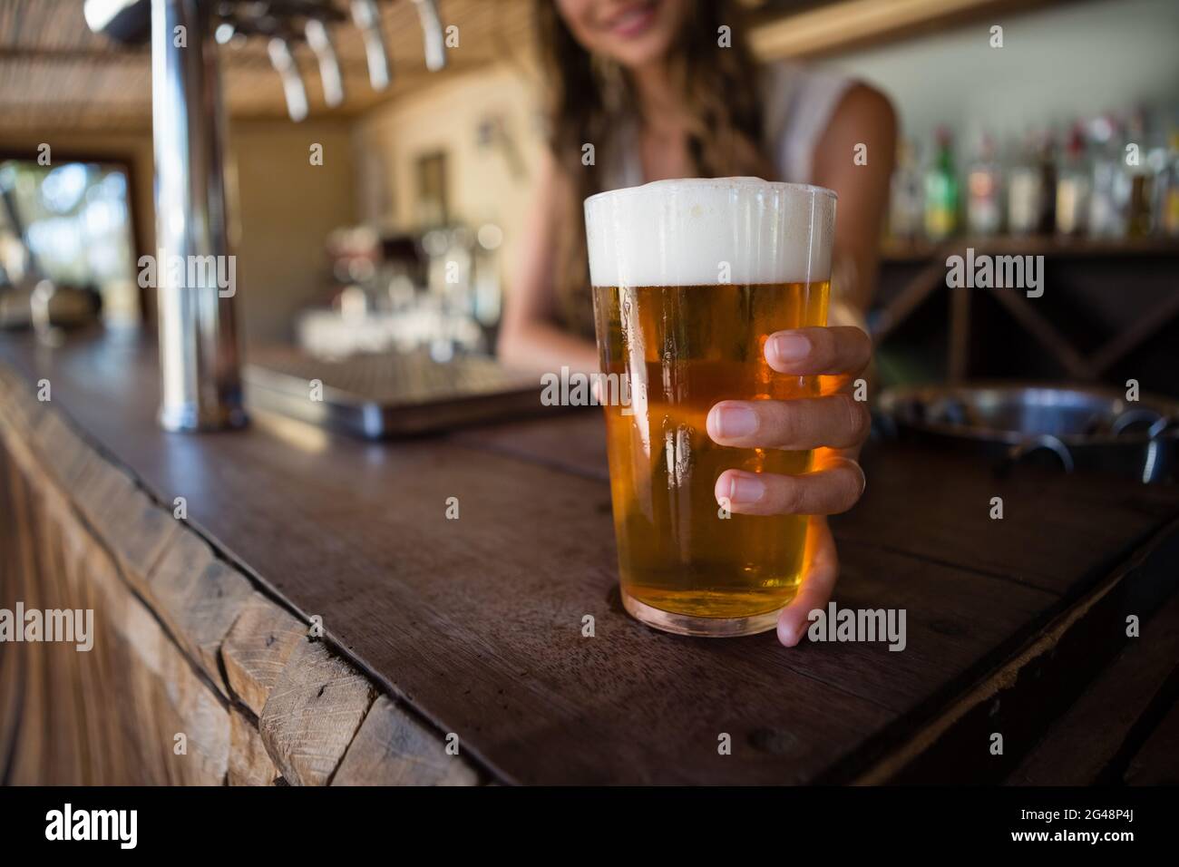 Barmaid at hotel bar hi-res stock photography and images - Alamy