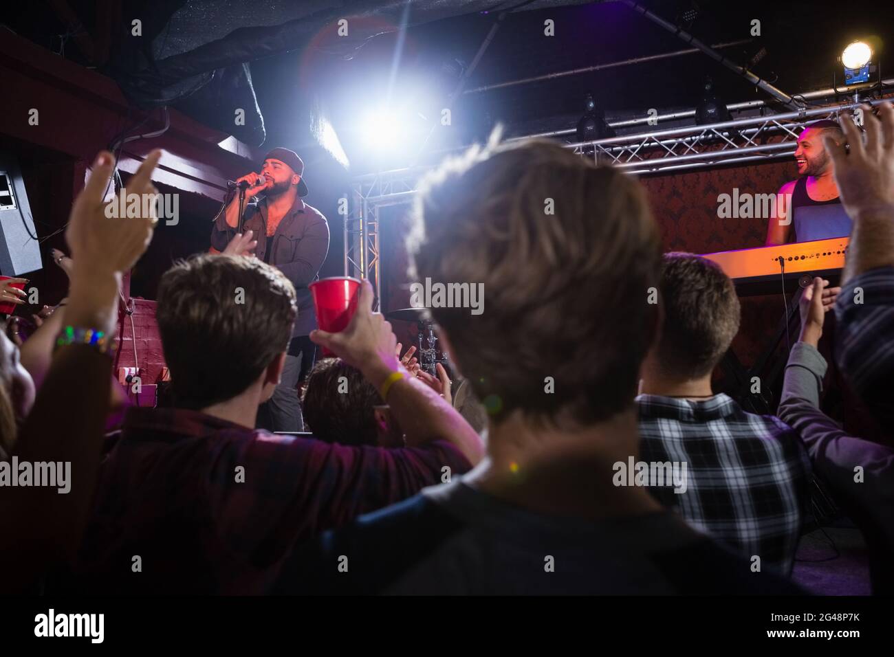 Singer performing on stage Stock Photo - Alamy