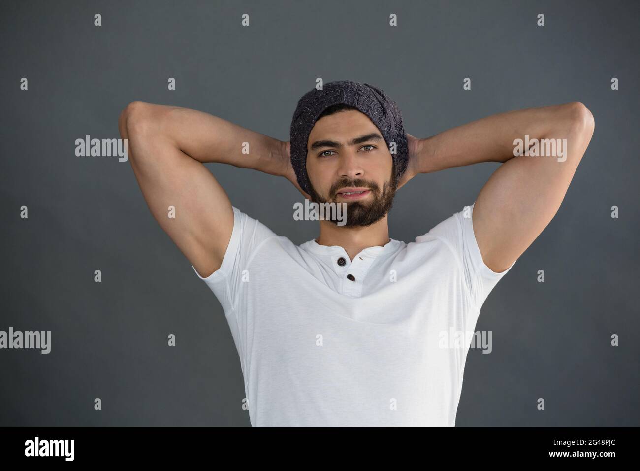 Portrait of man standing with hands behind back Stock Photo - Alamy
