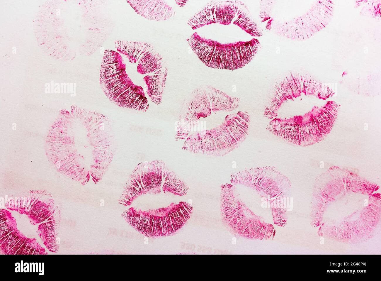 Abstract pink kisses isolated on white background. Lots of female lip ...