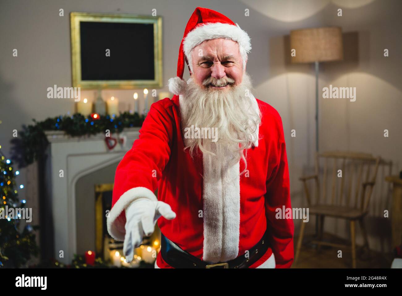 Portrait of smiling Santa Claus gesturing Stock Photo - Alamy