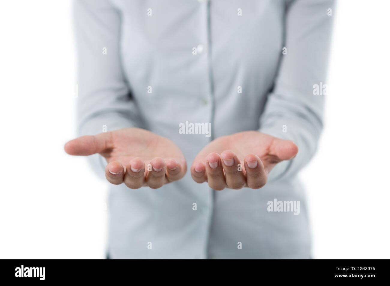 Female executive holding invisible object Stock Photo - Alamy