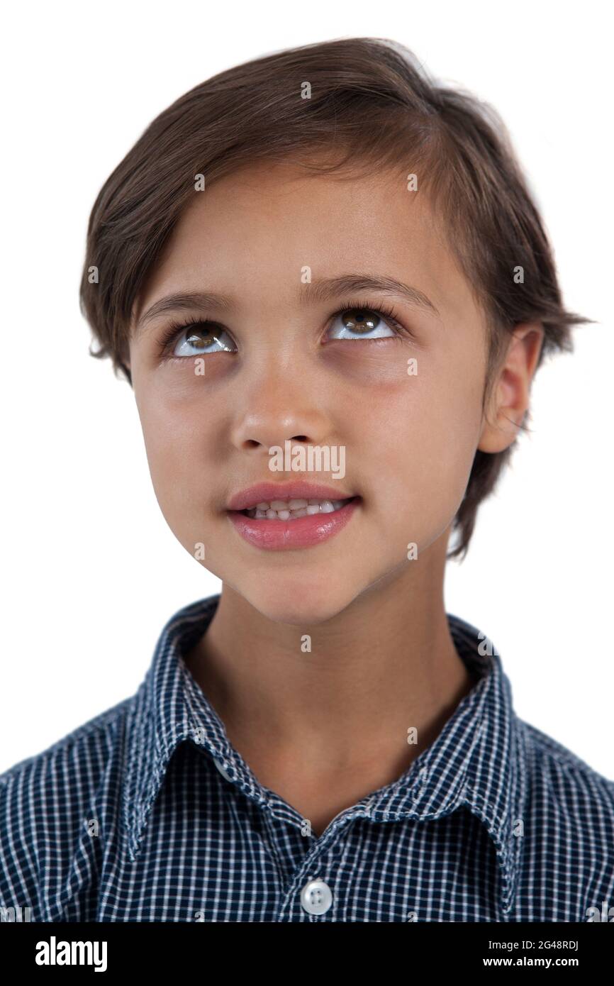 Boy standing against white background Stock Photo - Alamy
