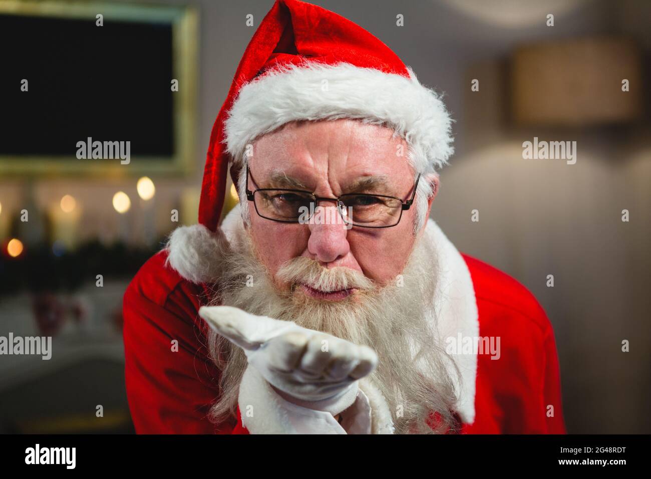Santa Claus blowing kiss Stock Photo - Alamy