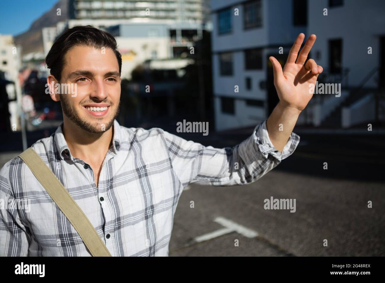 Smiling standing looking away gesturing hi-res stock photography and ...