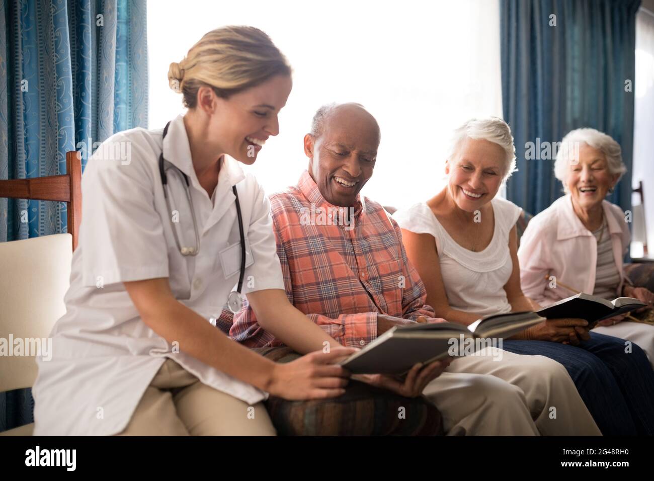 Doctor reading book hi-res stock photography and images - Alamy
