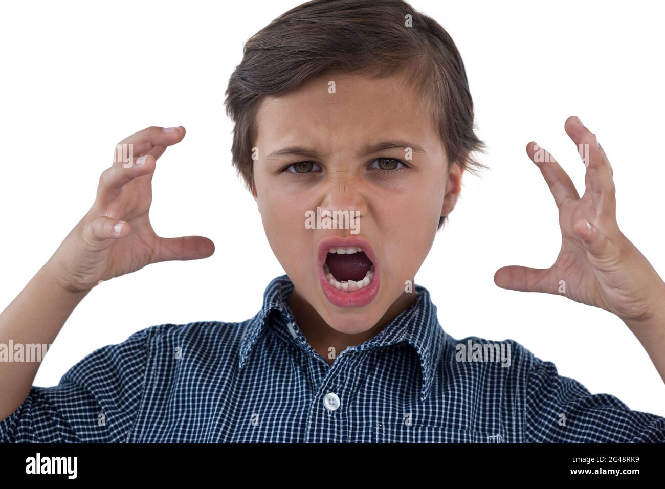 Cute boy shouting against white background Stock Photo - Alamy